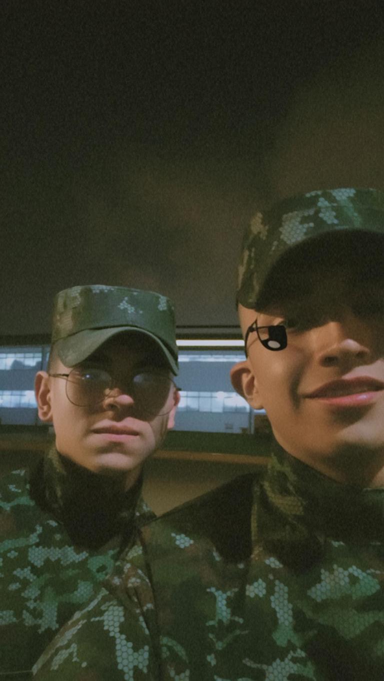 Courage in Camouflage: Soldiers Smiling Under the Stars