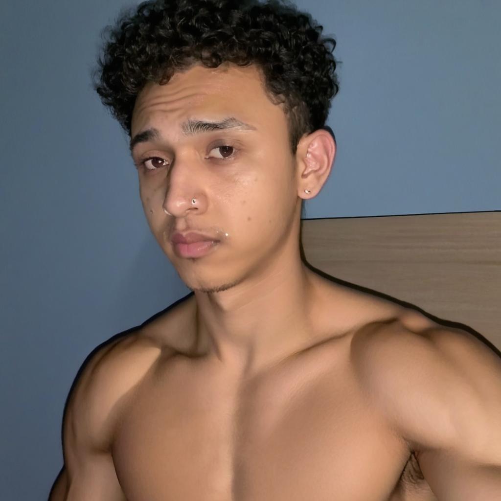 Teenage Boy in Surprise: Capturing Excitement in Dim Light