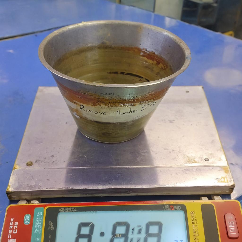 Rusty Bowl of Stones on Digital Scale: Weight 570.3