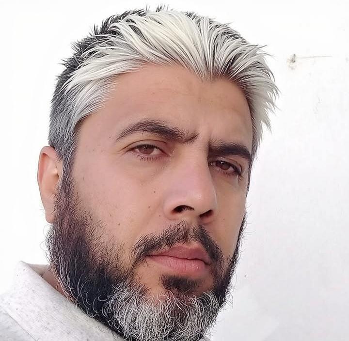 Mature Wisdom: A Portrait of a Thoughtful Middle-Eastern Man