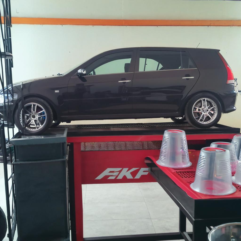 Sleek Modified Hatchback in Immaculate Garage | Idyllic AI